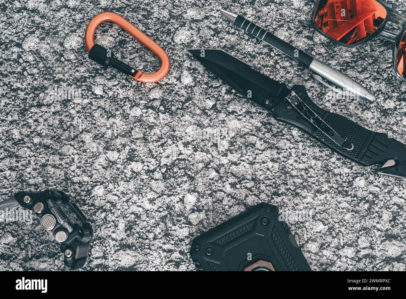 Flat lay of some Outdoor/EDC gear on a grey background Stock Photo - Alamy