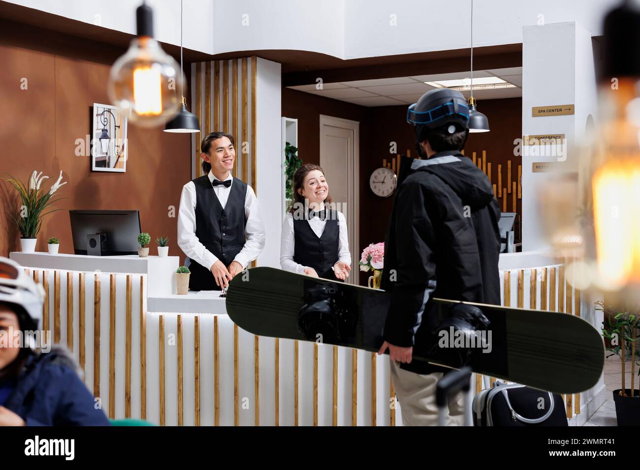 Assisting guest hi-res stock photography and images - Alamy