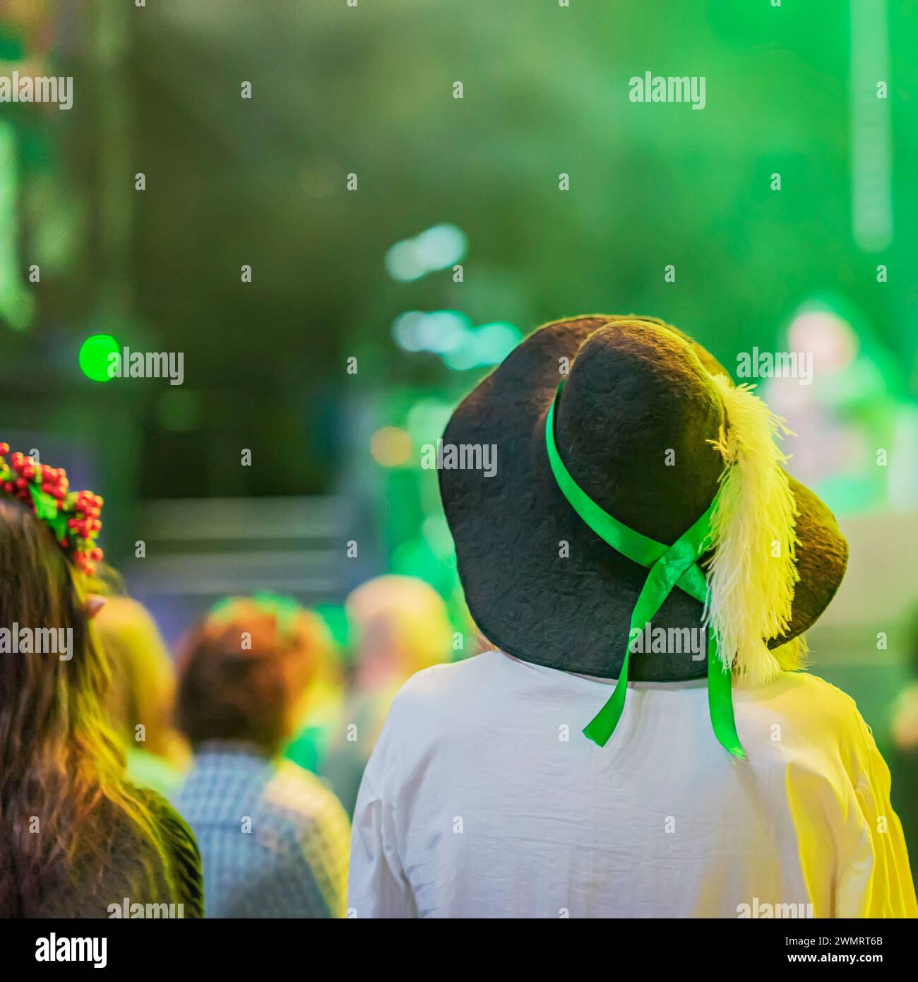 Back view of man in felt hat with wide brim, celebrating St. Patrick's ...