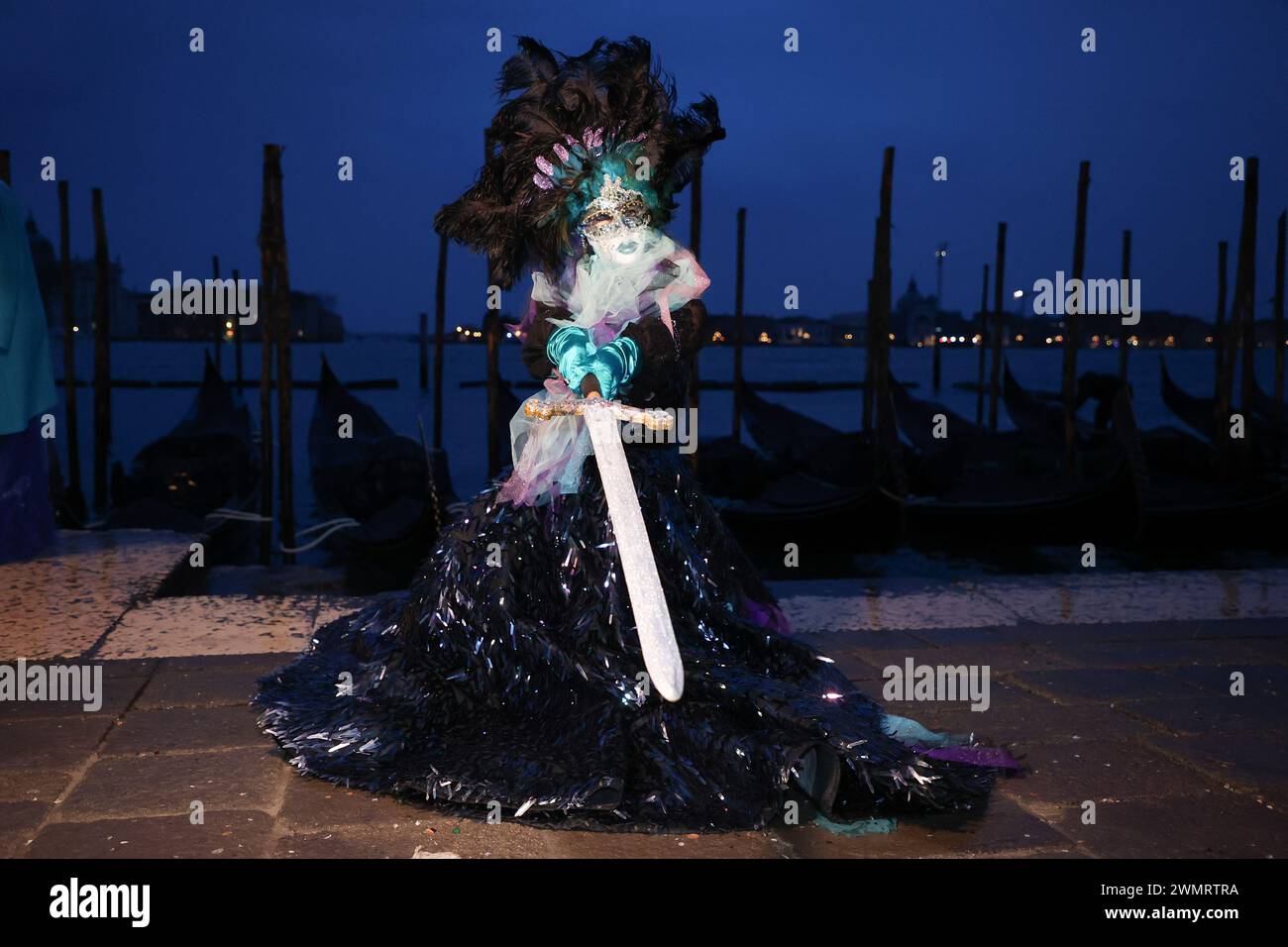 A participant seen wearing fancy costume during event. The Venice ...