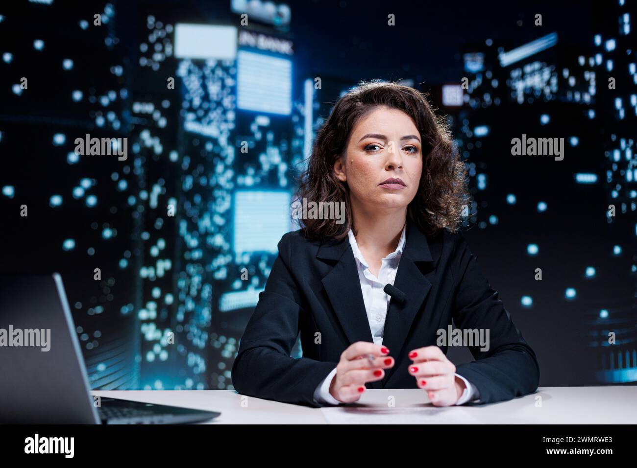 TV show host broadcasting information in newsroom, addressing all ...