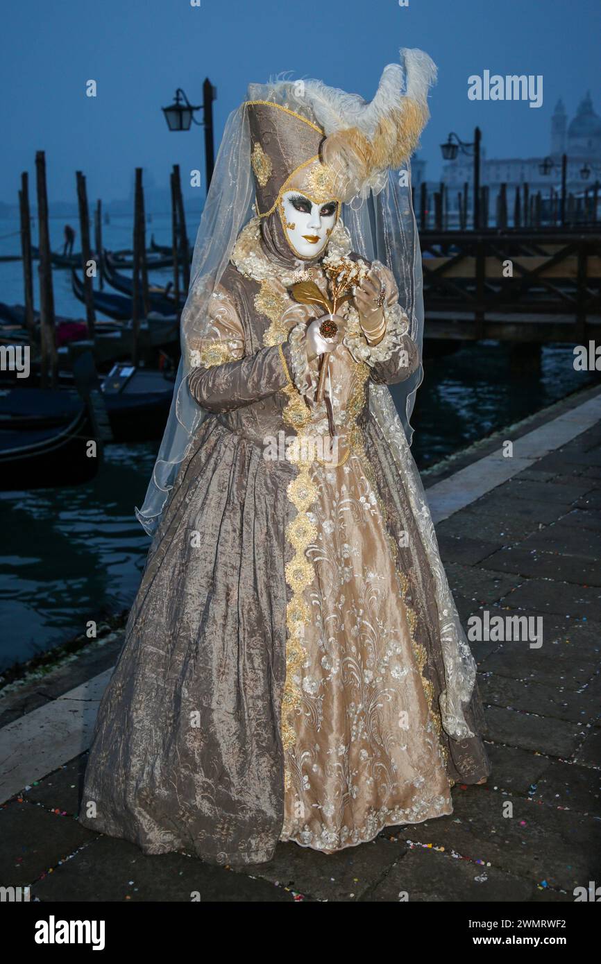 Venice, Italy. 07th Feb, 2024. A participant seen wearing fancy costume ...