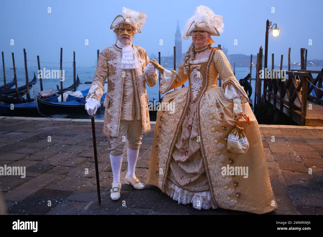 Venice, Italy. 7th Feb, 2024. A couple seen wearing fancy costumes ...