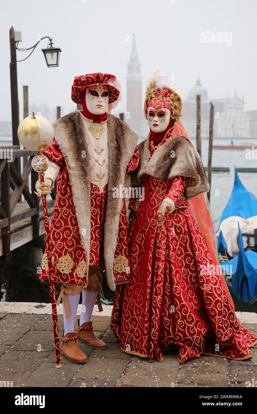 Venice, Italy. 8th Feb, 2024. A couple seen wearing fancy costumes ...