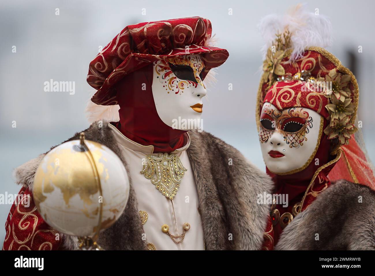 Venice, Italy. 8th Feb, 2024. A couple seen wearing fancy costumes ...