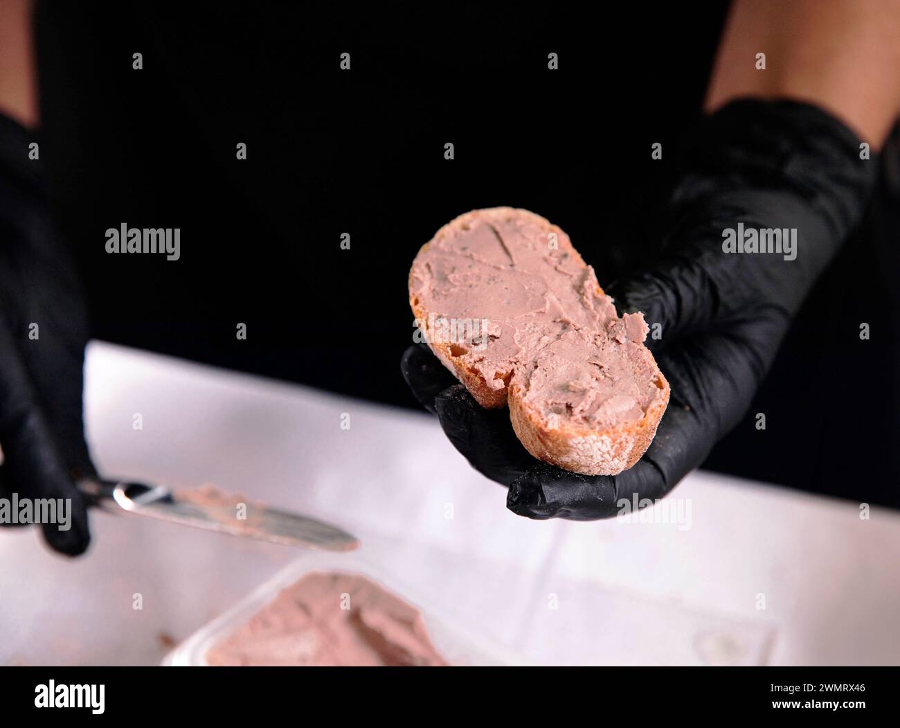 Spreading Pâté on Toasted Bread for a Gourmet Food Presentation Stock ...