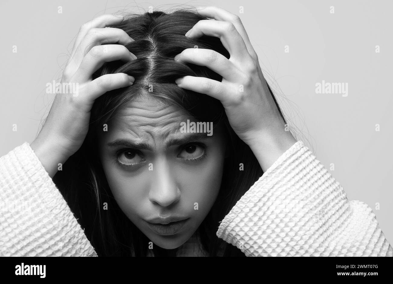 Woman with hair problem. Woman is looking shocked to her lost hair ...