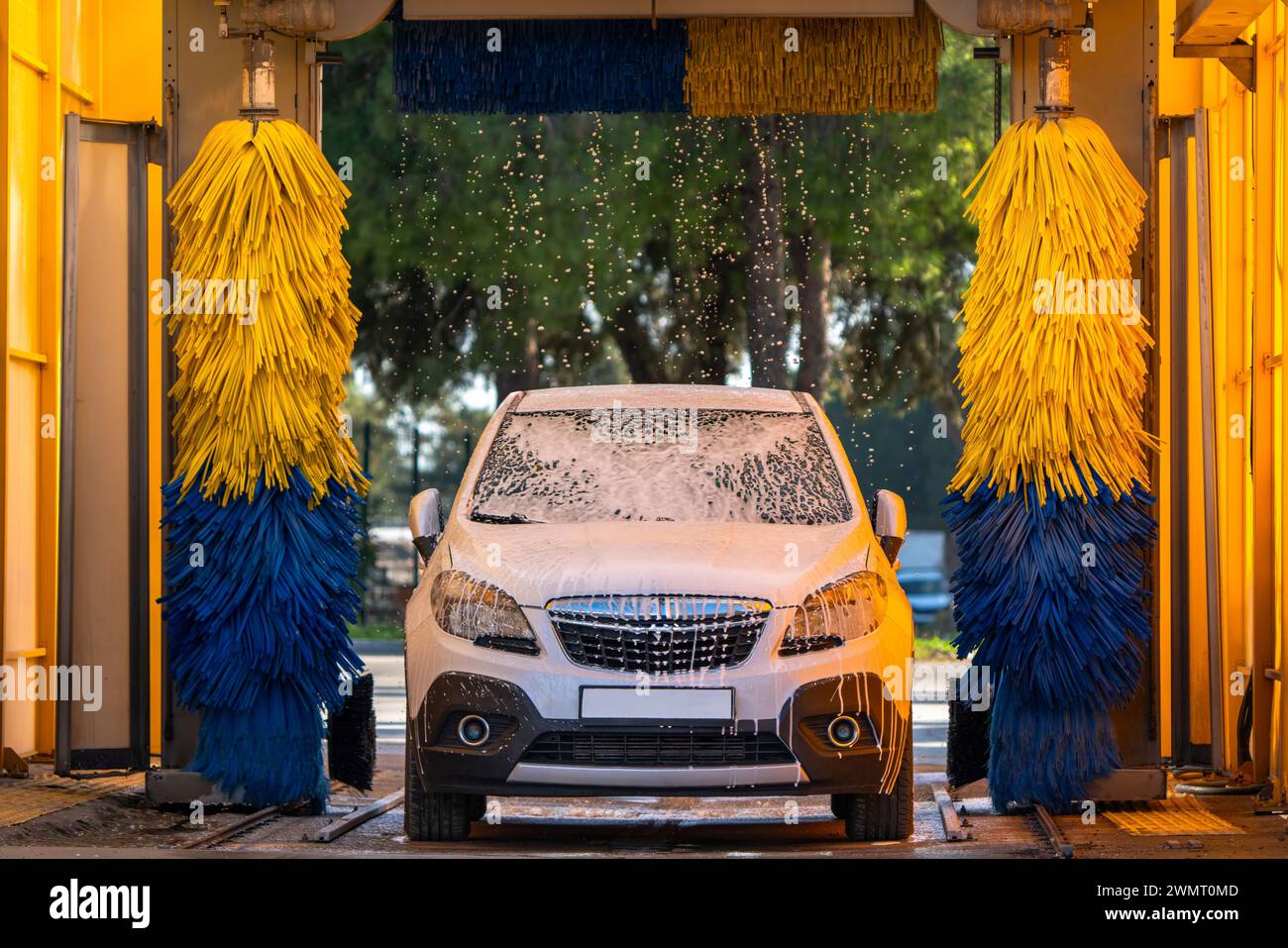 Washing the car in an automatic washing machine. Brushed Car Washing ...