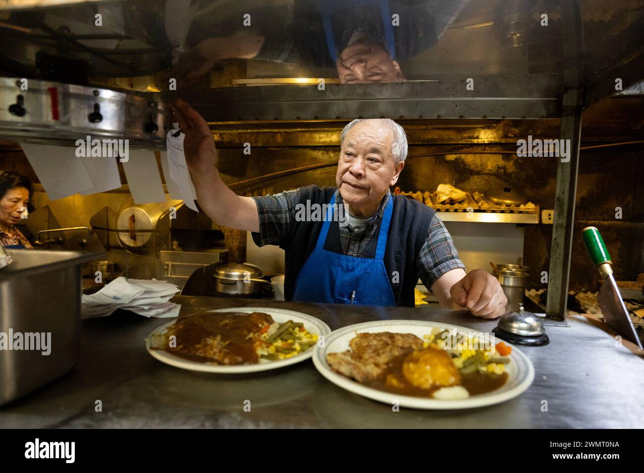 Woodland, Ca, USA. 23rd Feb, 2024. Paul Fong prepares order as his wife ...