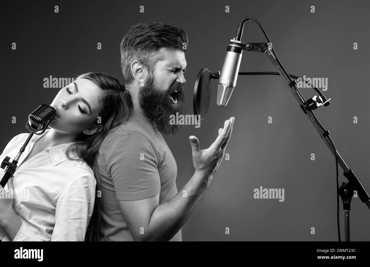 Couple singing. Coupl in recording studio. Music performance vocal ...