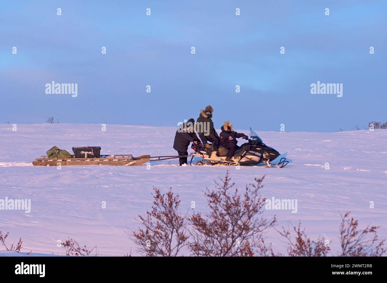 inupiats snowmachining outside the arctic town of Kotzebue heading to ...