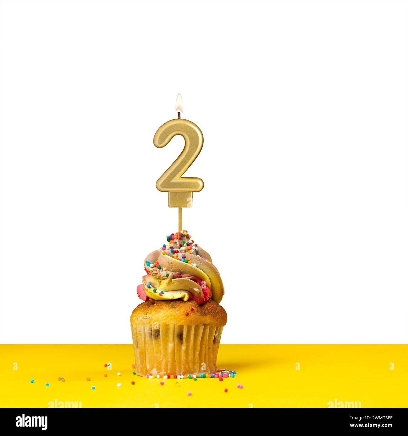 Birthday candle number 2 - Cupcake on white background Stock Photo - Alamy