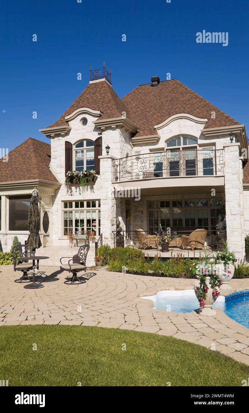 In-ground swimming pool with spa in backyard of luxurious two story ...