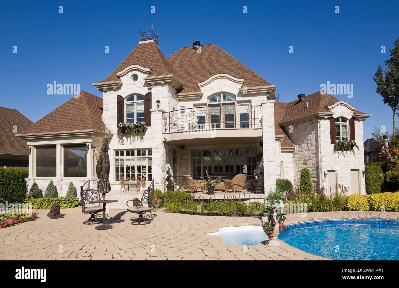 In-ground swimming pool with spa in backyard of luxurious two story ...