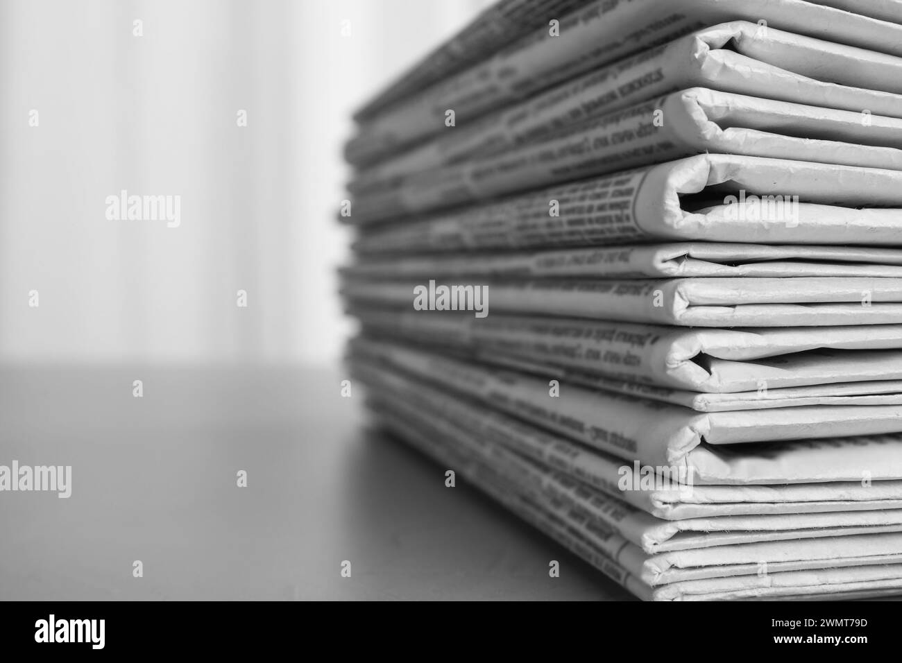 Stack of newspapers on table Black and White Stock Photos & Images - Alamy