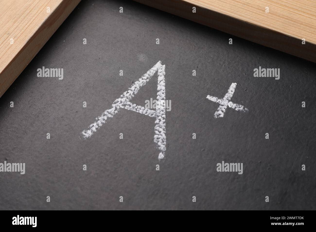 School grade. Letter A with plus symbol on blackboard, closeup Stock ...