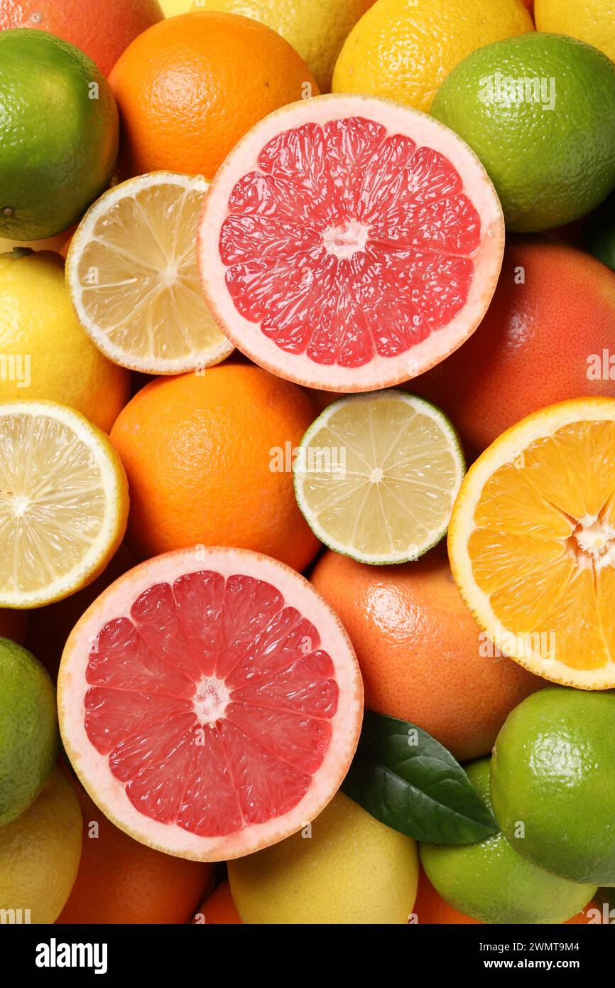 Different fresh citrus fruits as background, top view Stock Photo - Alamy