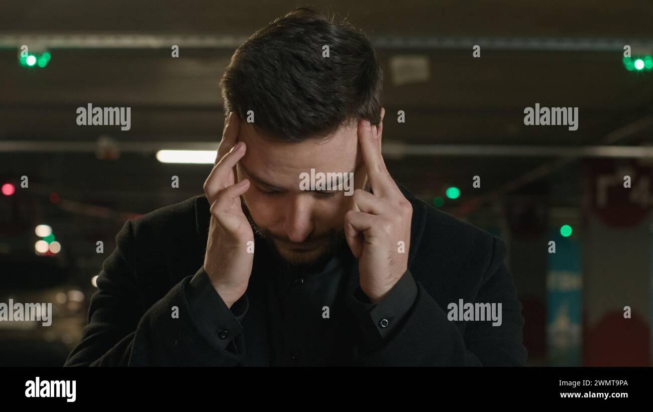 Sick Caucasian man suffer from headache pain male businessman touch head massaging temples feel ...