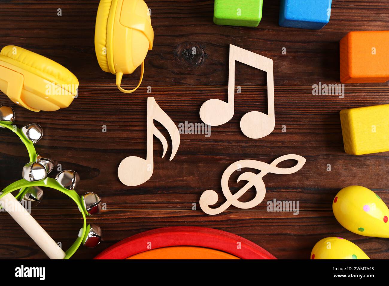 Baby song concept. Wooden notes, tambourines and toys on table, flat ...