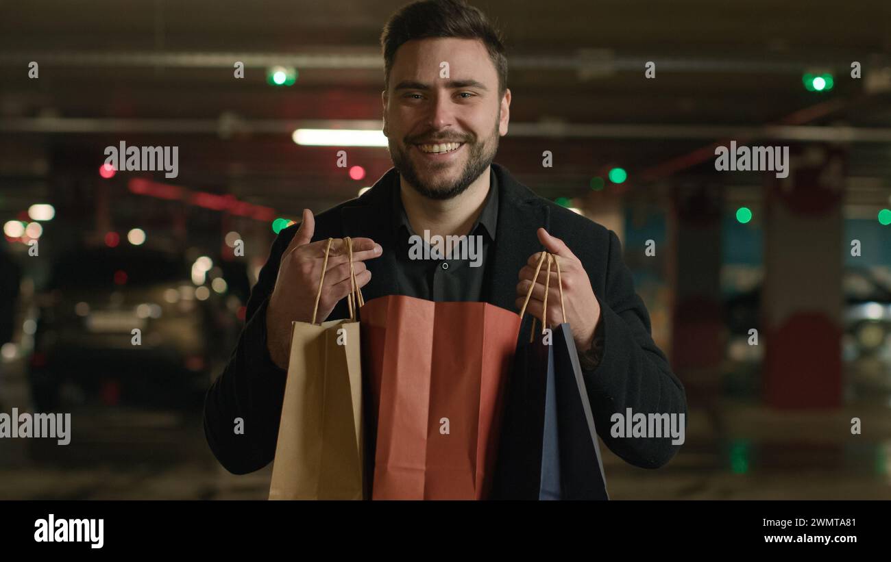 Excited Caucasian man unpack package buyer shopaholic shopper consumer ...