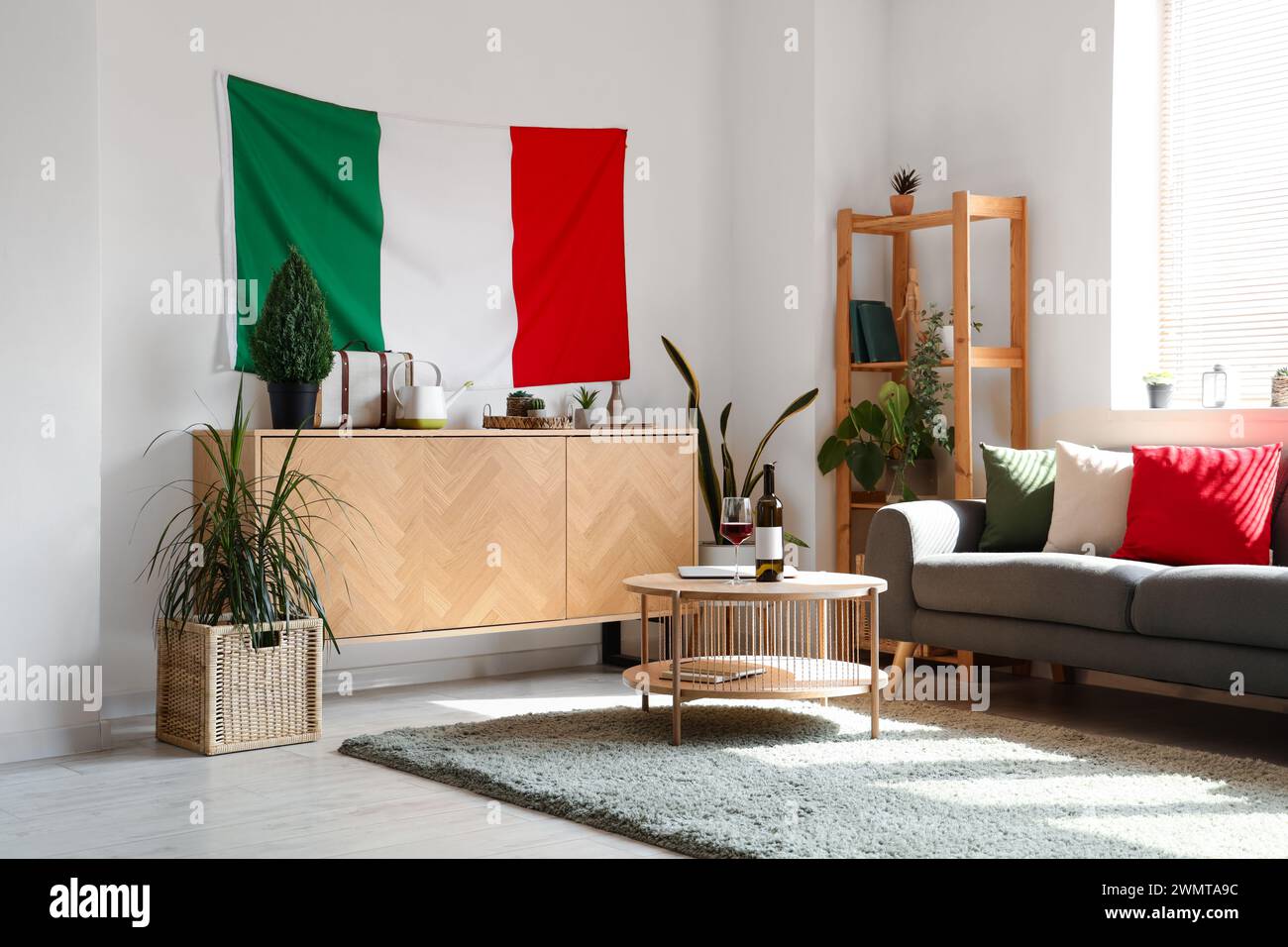 Interior of stylish living room with hanging Italian flag Stock Photo ...