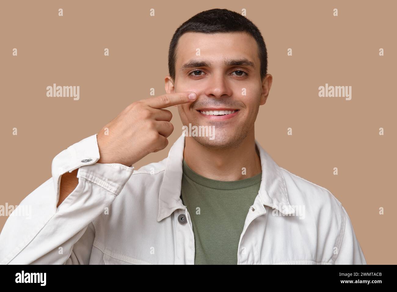 Pointing to nose hi-res stock photography and images - Alamy