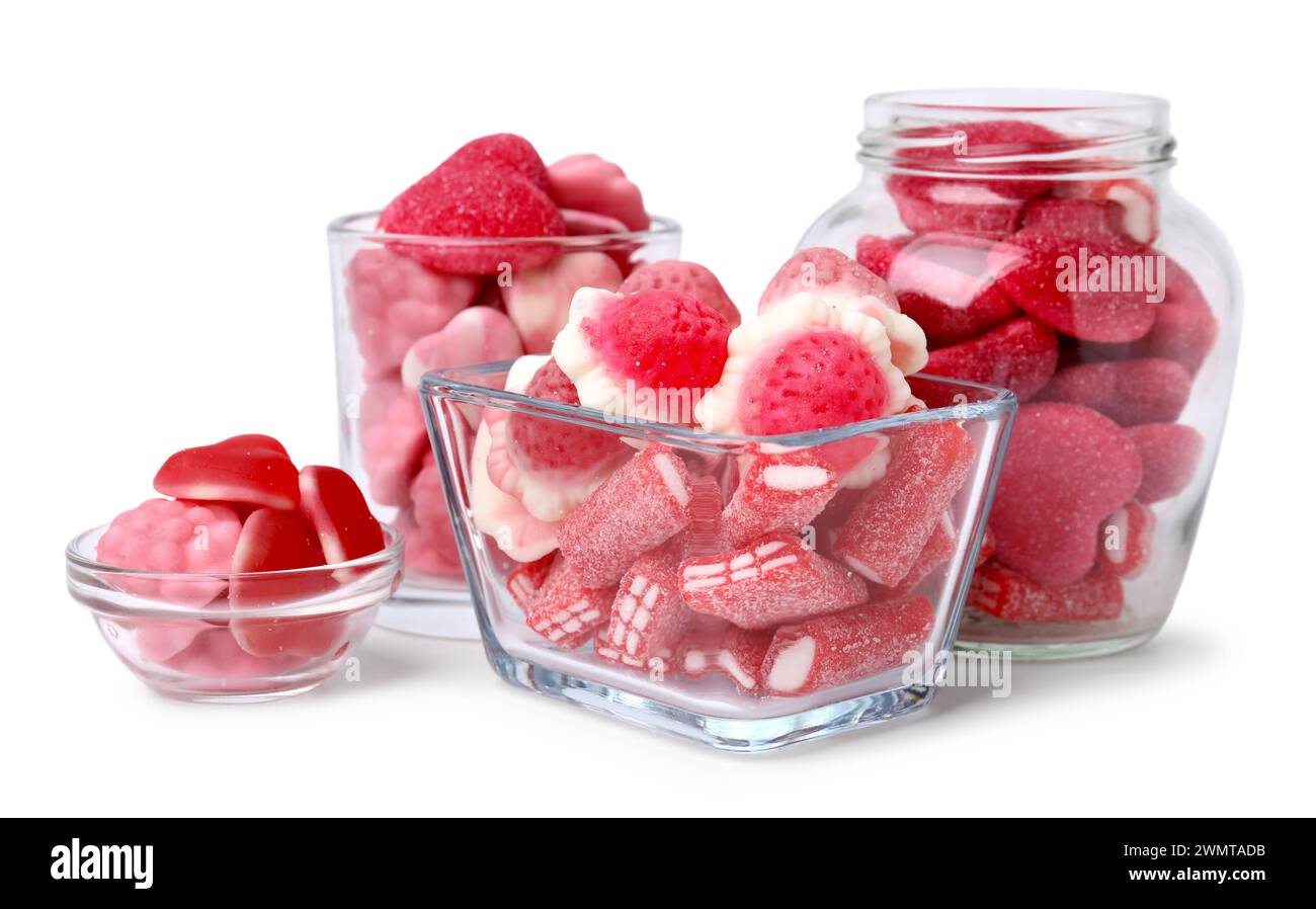 Different yummy candies in glass jar and bowls isolated on white Stock ...