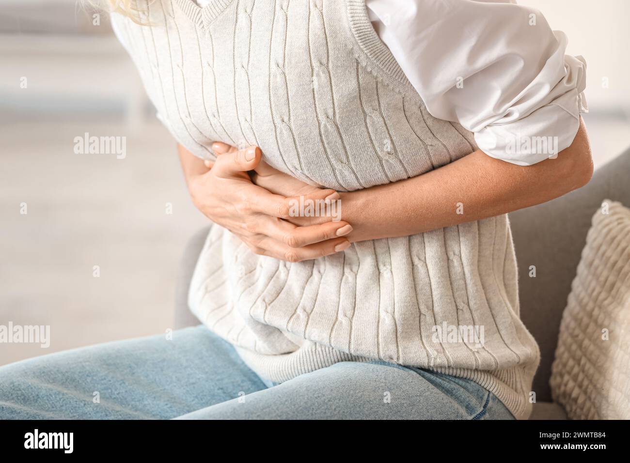 Bellyache woman mature hi-res stock photography and images - Alamy