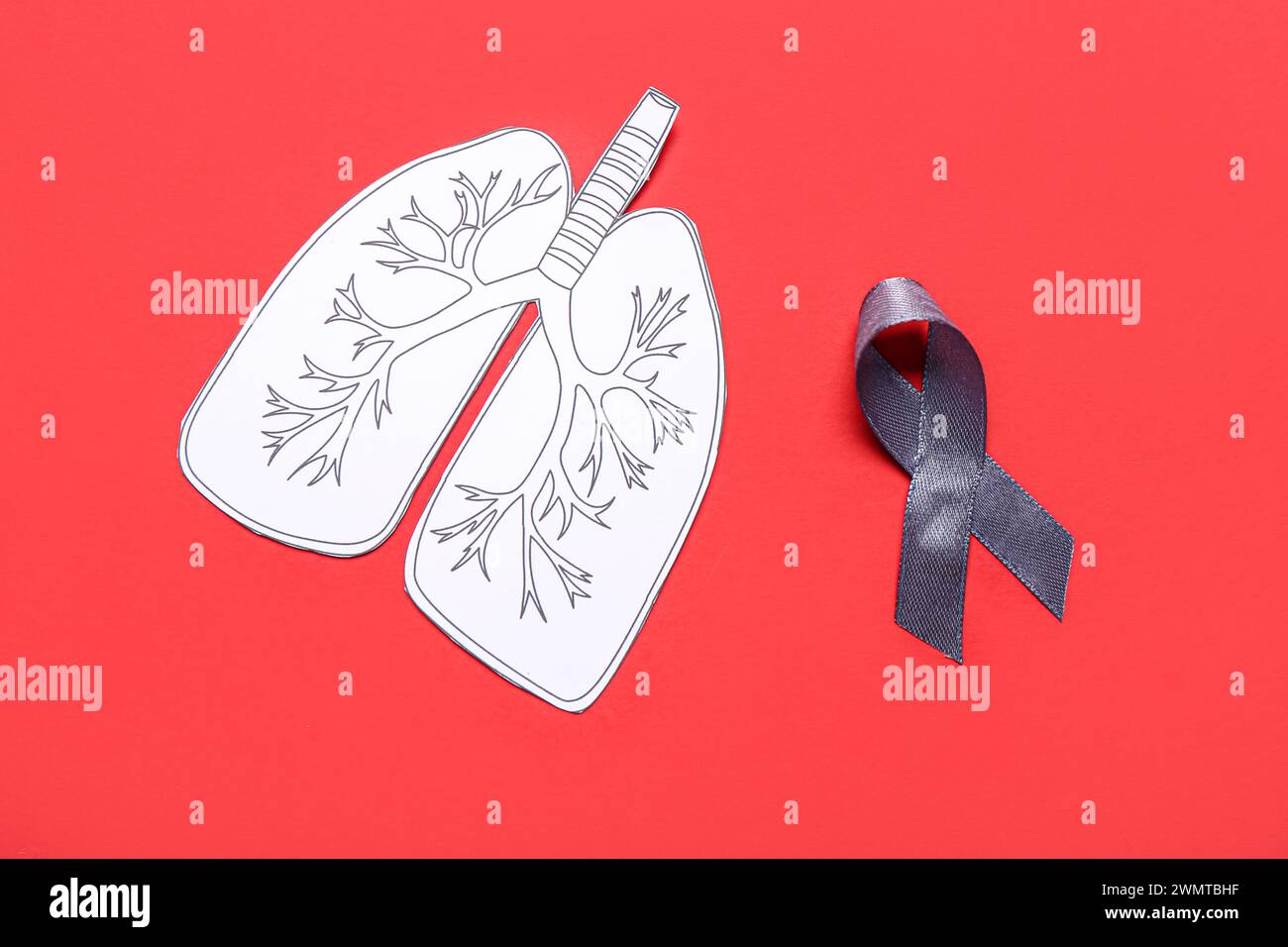 Drawn paper lungs with grey ribbon on red background Stock Photo - Alamy