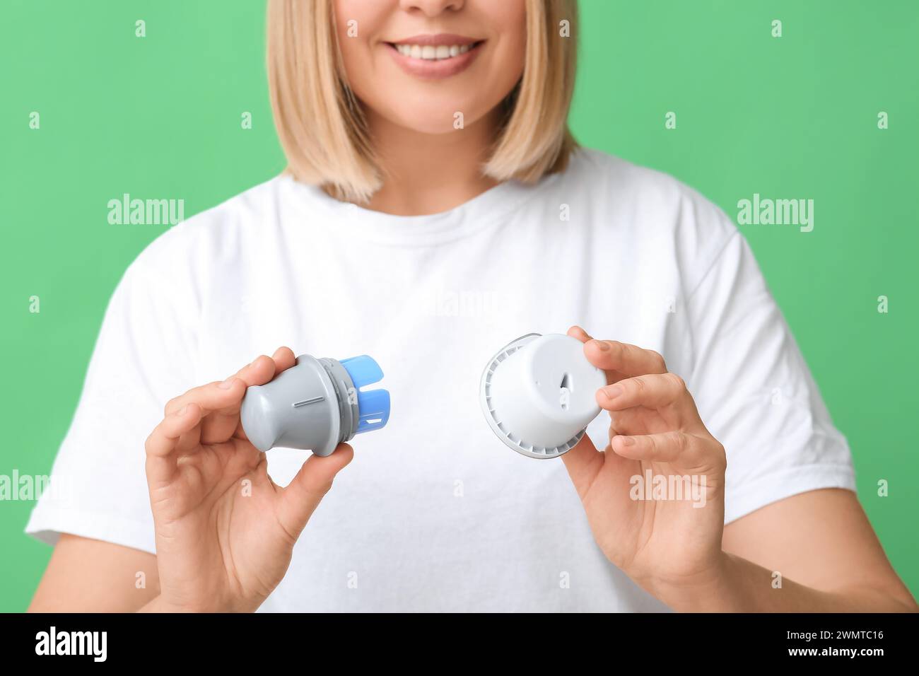 Woman with glucose sensor for measuring blood sugar level and ...