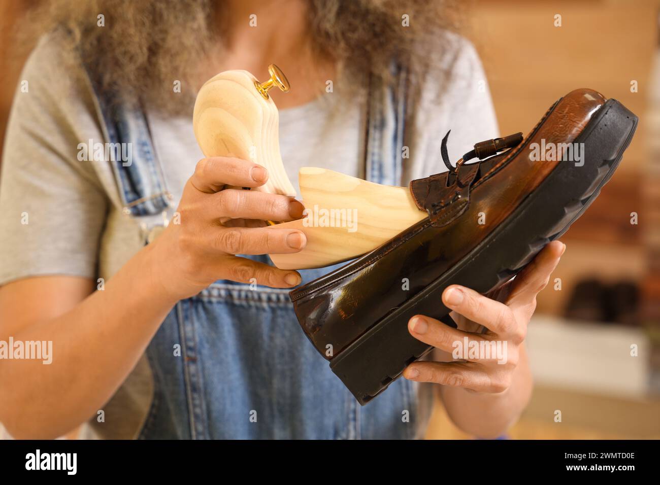 Female shoemaker wooden shoe hi-res stock photography and images - Alamy