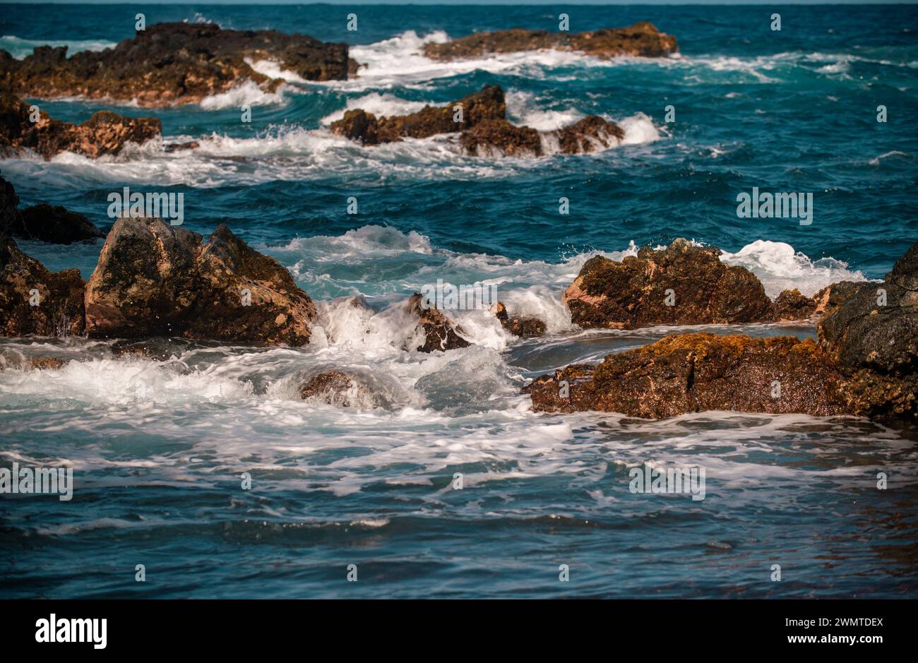 Rock and sea. View of turuoise water and lava rocks beach, atlantic ...