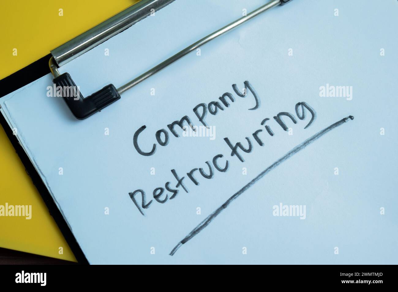 Concept of Company Restructuring write on paperwork isolated on wooden ...