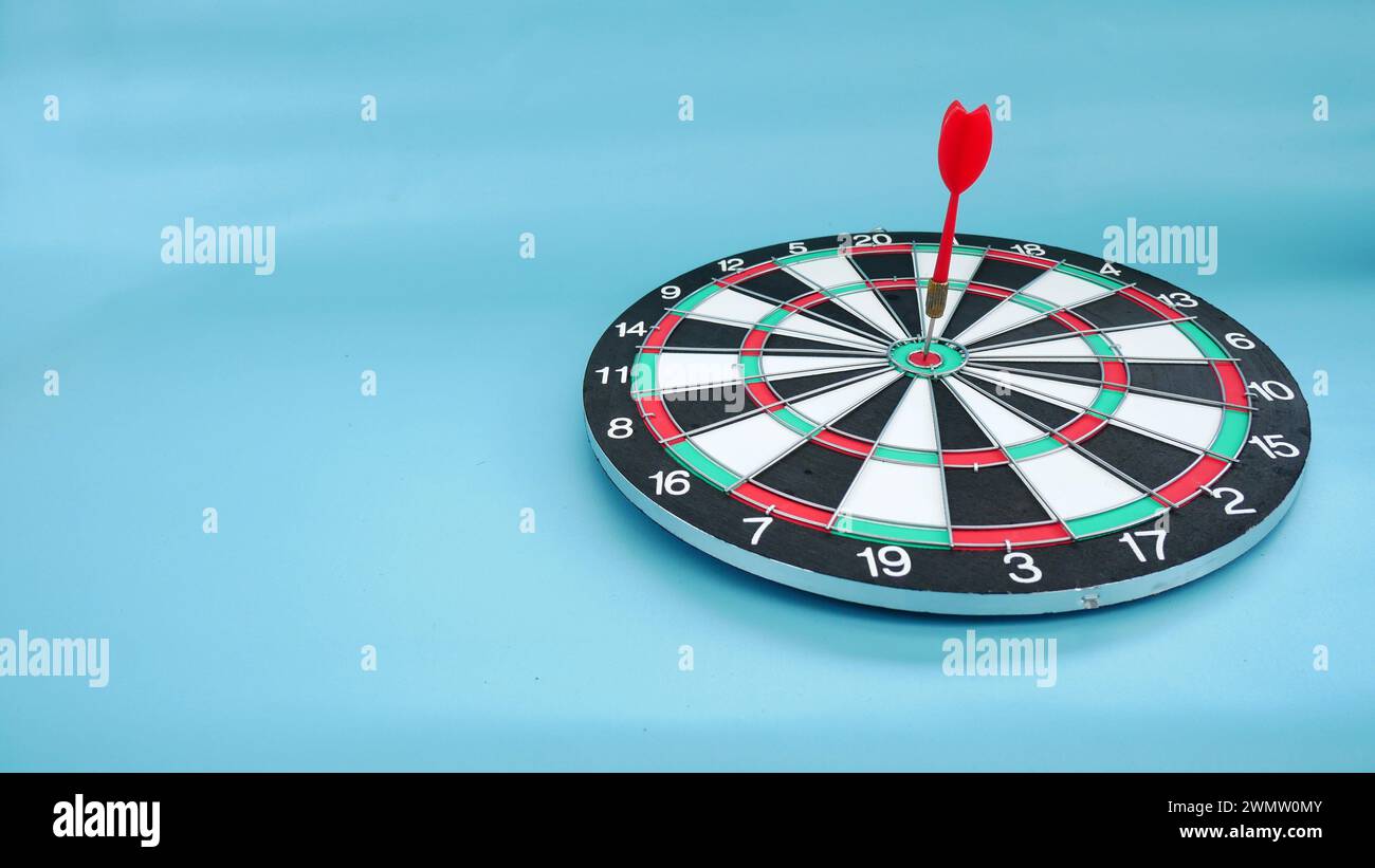 The human hand and arrow hit the center of the target board Stock Photo ...