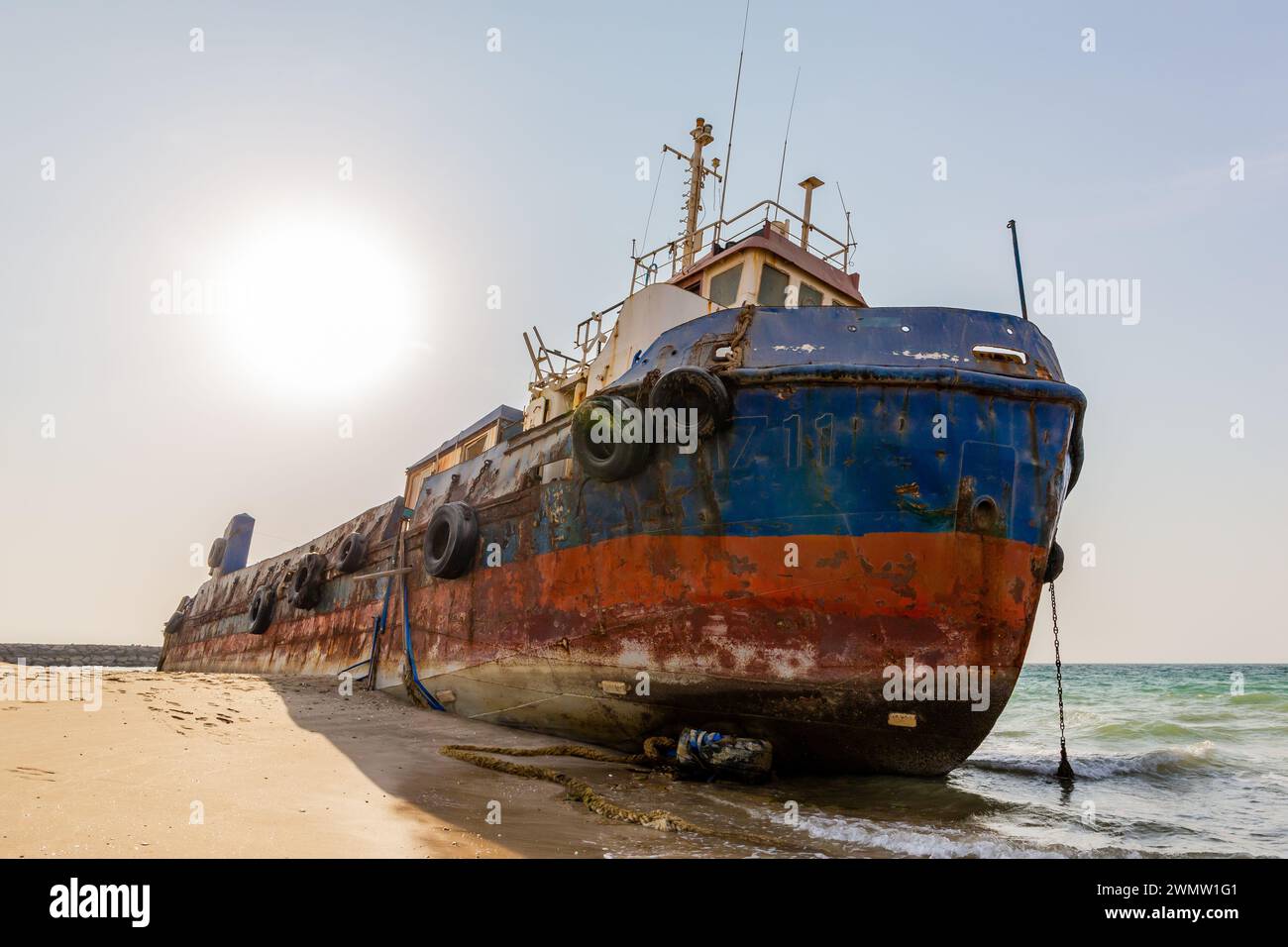 Cargo ship wreck washed ashore on the Al Hamriyah beach in Umm Al ...