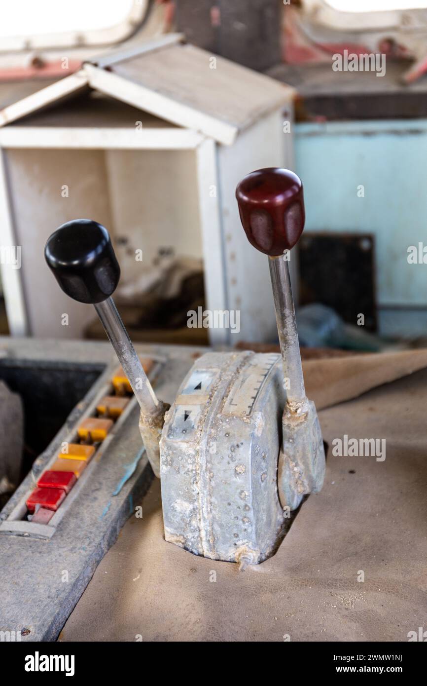 Throttle levers close-up in a wheelhouse of the abandoned, old cargo ...