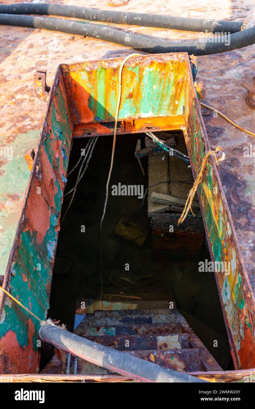 Damaged gangway with ladder leading to lower deck of a crashed cargo ...