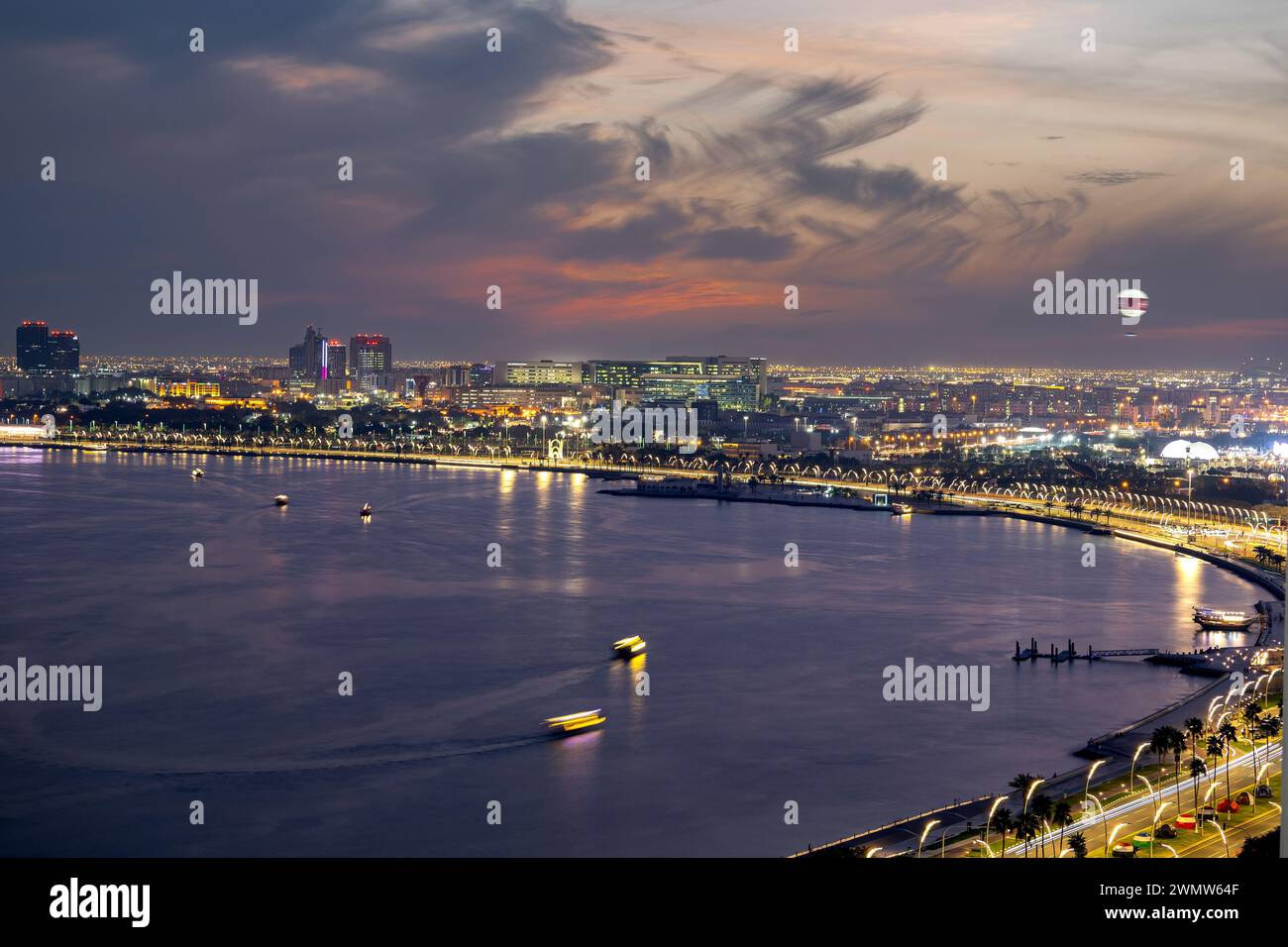 Aerial view of Doha Corniche sunset sunrise. Corniche road and traffic ...