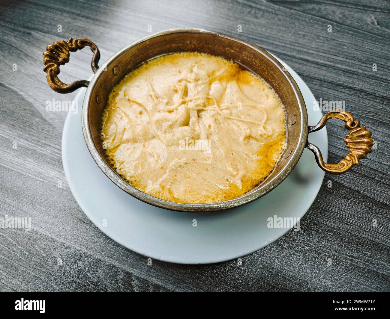 Traditional Turkish meal called Mihlama or Kuymak served in a hot pan ...