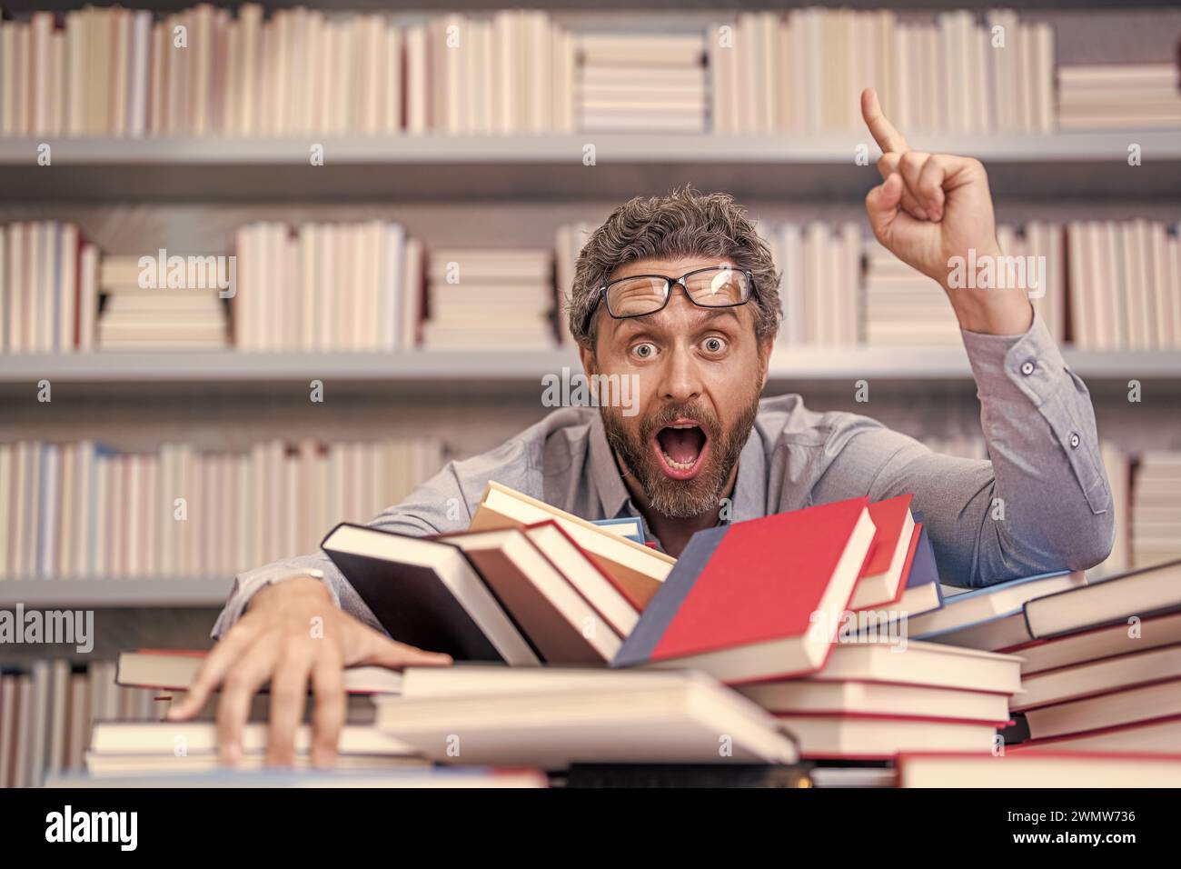 school teacher loves education. bookworm nerd in school library ...