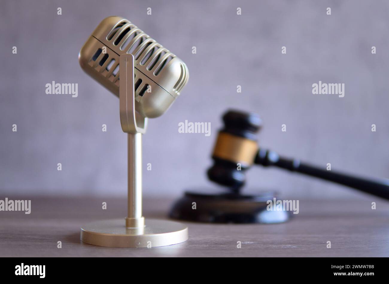 Closeup image of microphone and judge gavel. Entertainment law concept ...