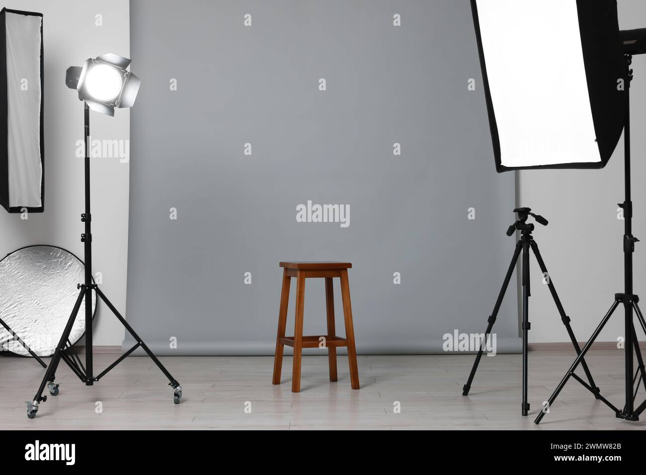 Empty stool surrounded by professional lighting equipment in photo ...
