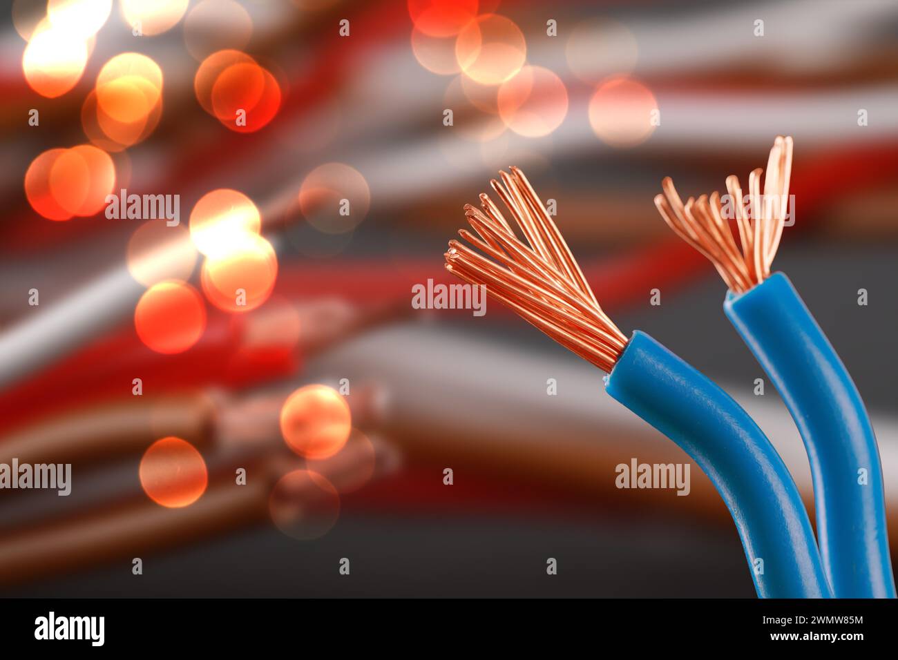 Electrical wires against background with blurred lights, closeup. Space ...