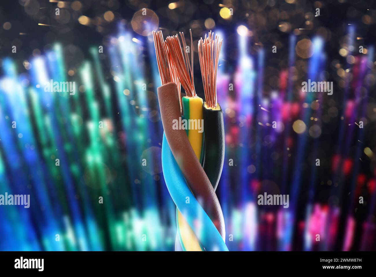 Colorful electrical wires against blurred background, closeup. Bokeh ...