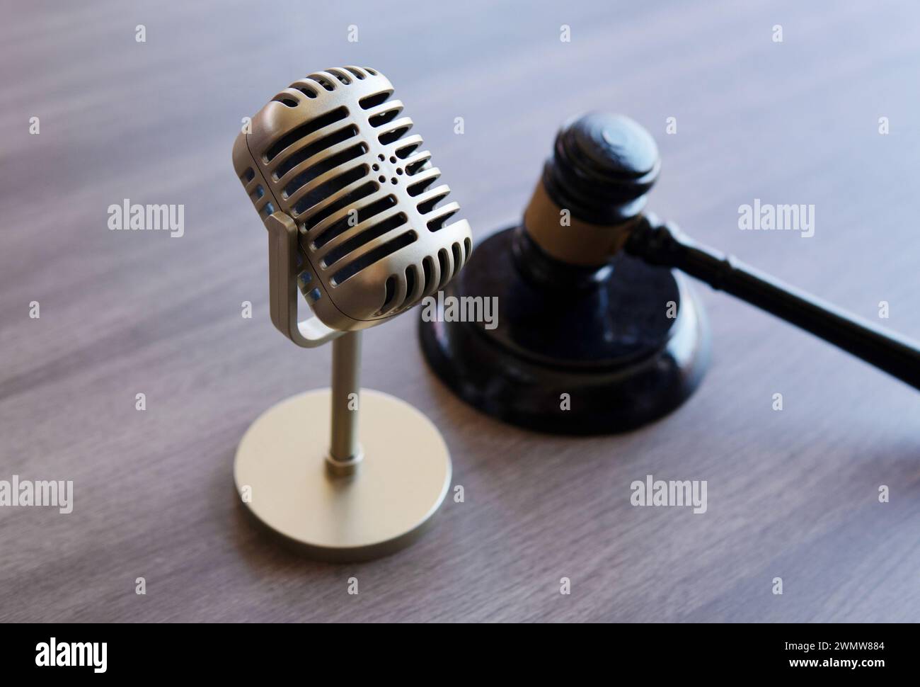 Closeup image of microphone and judge gavel. Entertainment law concept ...