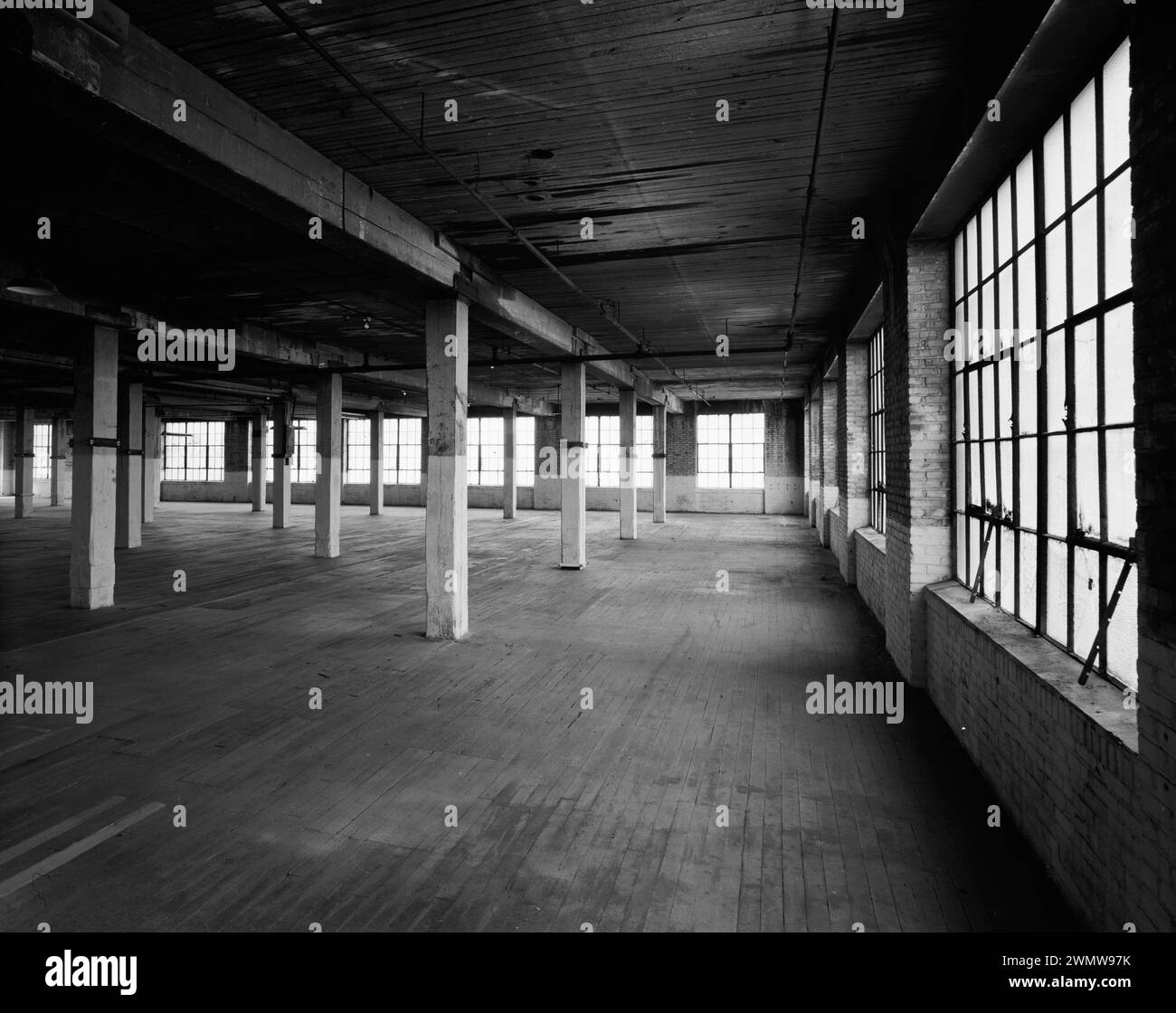 Empty industrial warehouse factory complex Black and White Stock Photos ...