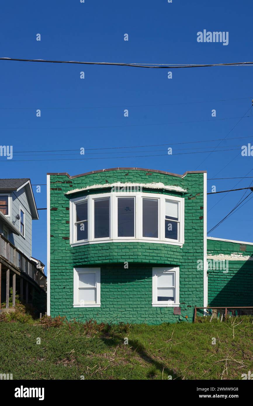 Green house with rounded multi window design at Dillon Beach ...