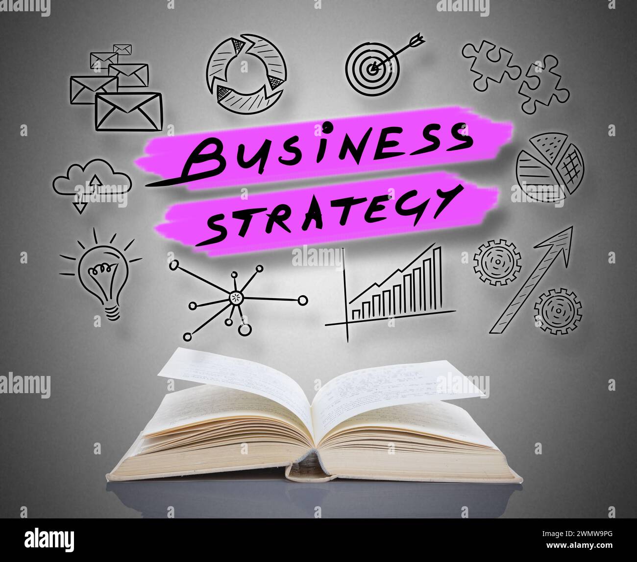 Business strategy concept above an open book Stock Photo - Alamy