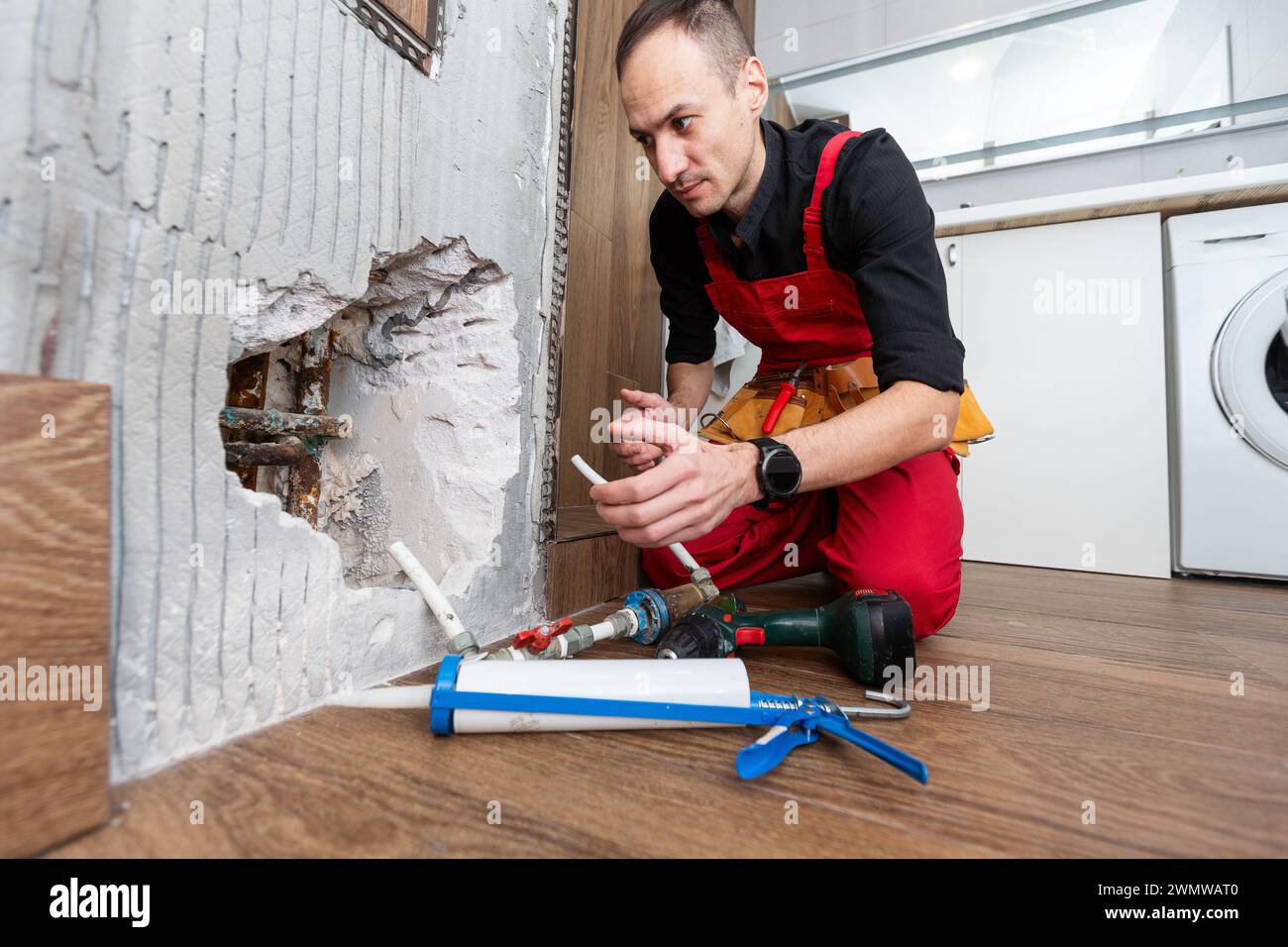 Construction man using hammer and tool while demolish wall Stock Photo ...