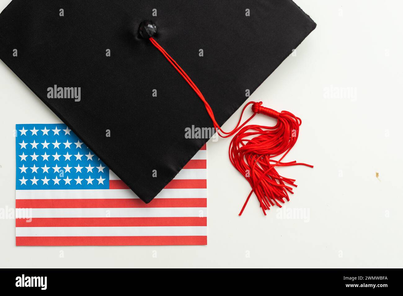 graduation hat on US flag, education concept Stock Photo - Alamy
